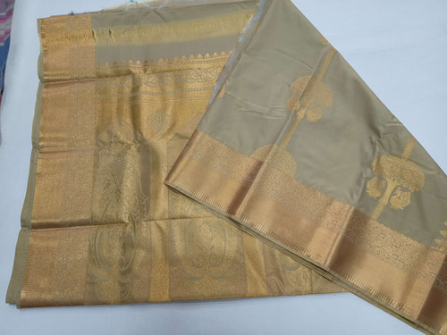 Oyster colour kanchipuram pattu saree peacock Jari putta design ...