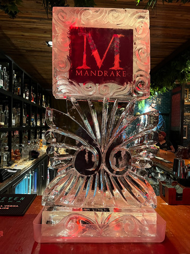 Mandrake Miami Restaurant Logo on Decorative Pillar | ice and fruits
