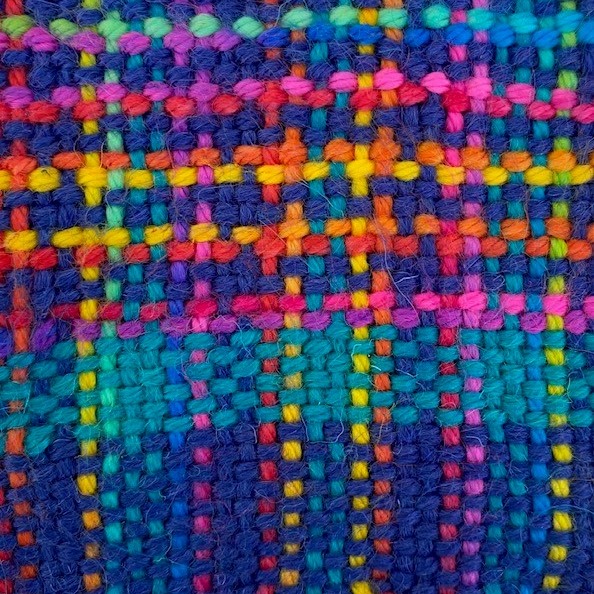 Weaving a small visible mending patch using a weaving loom kit - make ...