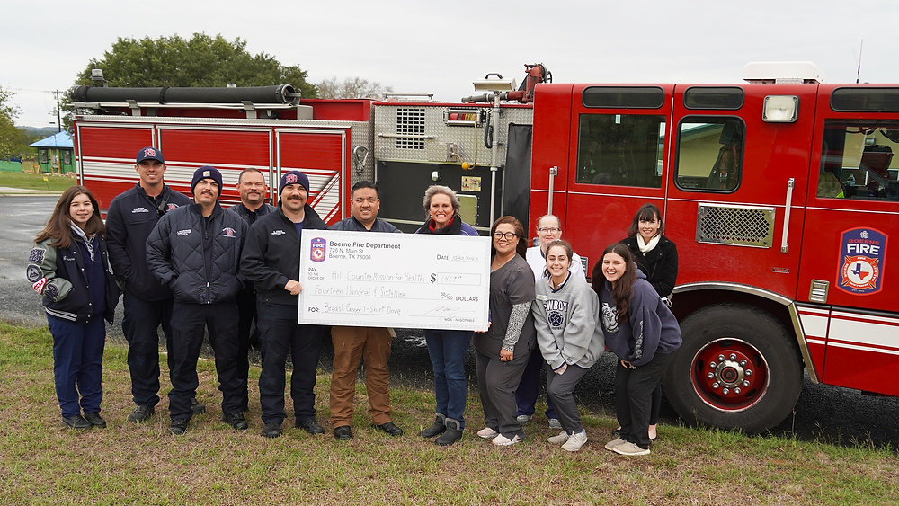Boerne - Fire Dept gives $$ to Hill Country Mission for Health