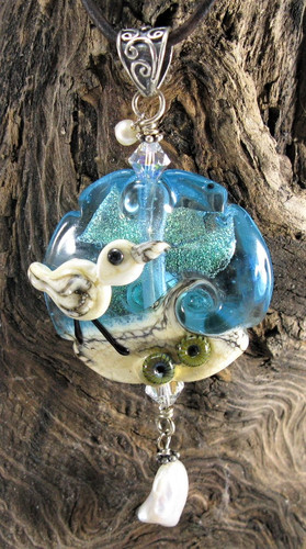 Wave with sand piper | website