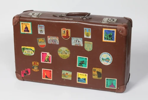 Suitcase with labels £12 to hire | Wedding Prop Shop