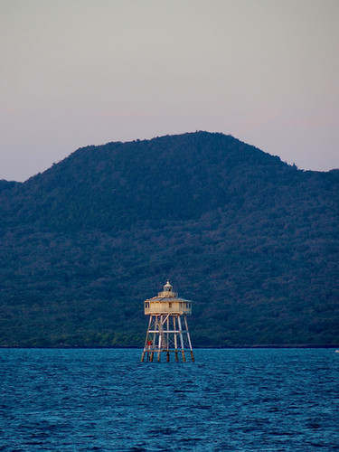 Rangitoto Island During Sunset With Bean Rock Lighthouse In Front In ...
