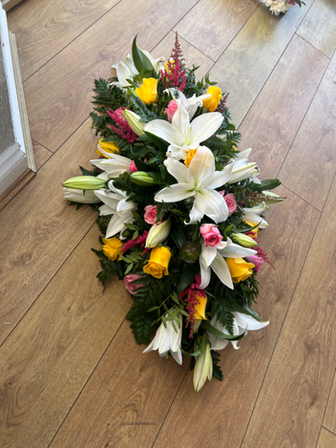 Beautiful pink and Yellow coffin top. | Say It With Flowers