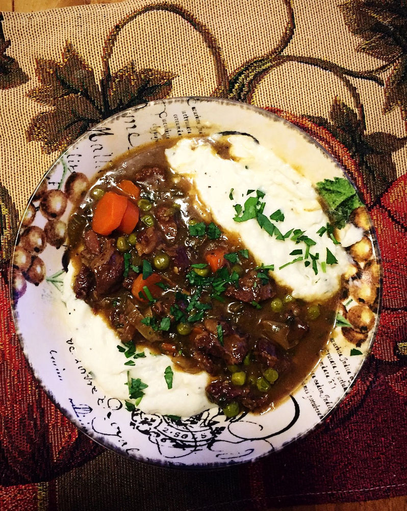 Hearty Beef Stew Over Garlic Mashed Potatoes