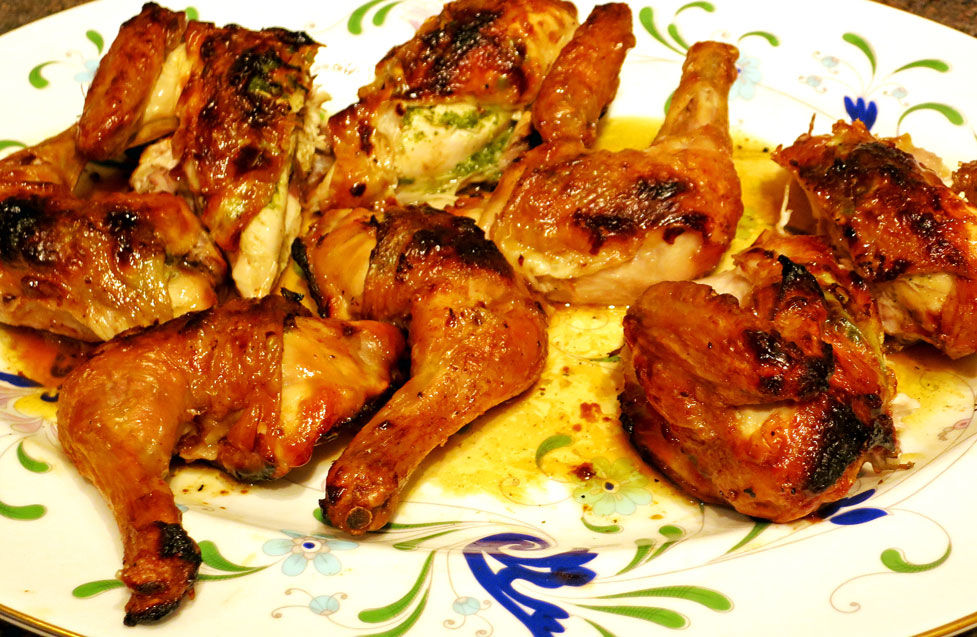 Spatchcock Poussin with tarragon, parsley and garlic butter