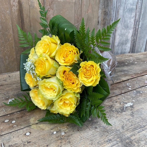 A Dozen Roses Wrapped in A Bouquet | Backyard Flower Shop
