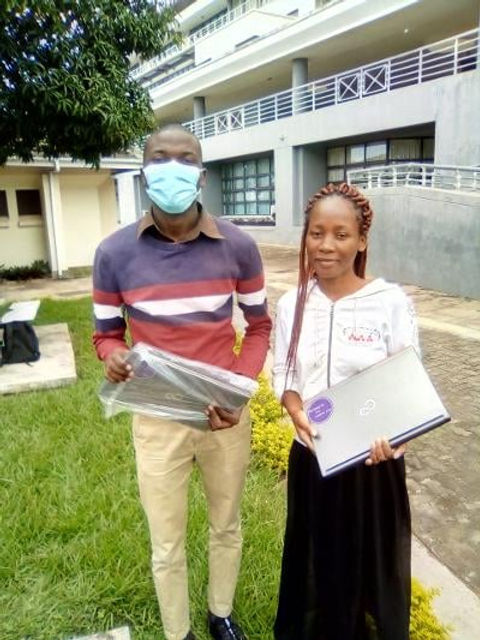 Gomezgani Phiri and Zeress Reuben receiving computers.