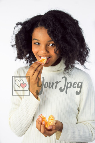 Tween girl smiling biting orange | Your Jpeg| https://static.wixstatic ...