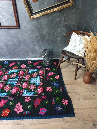 Handwoven floral wool rug, black background with pink roses and ...