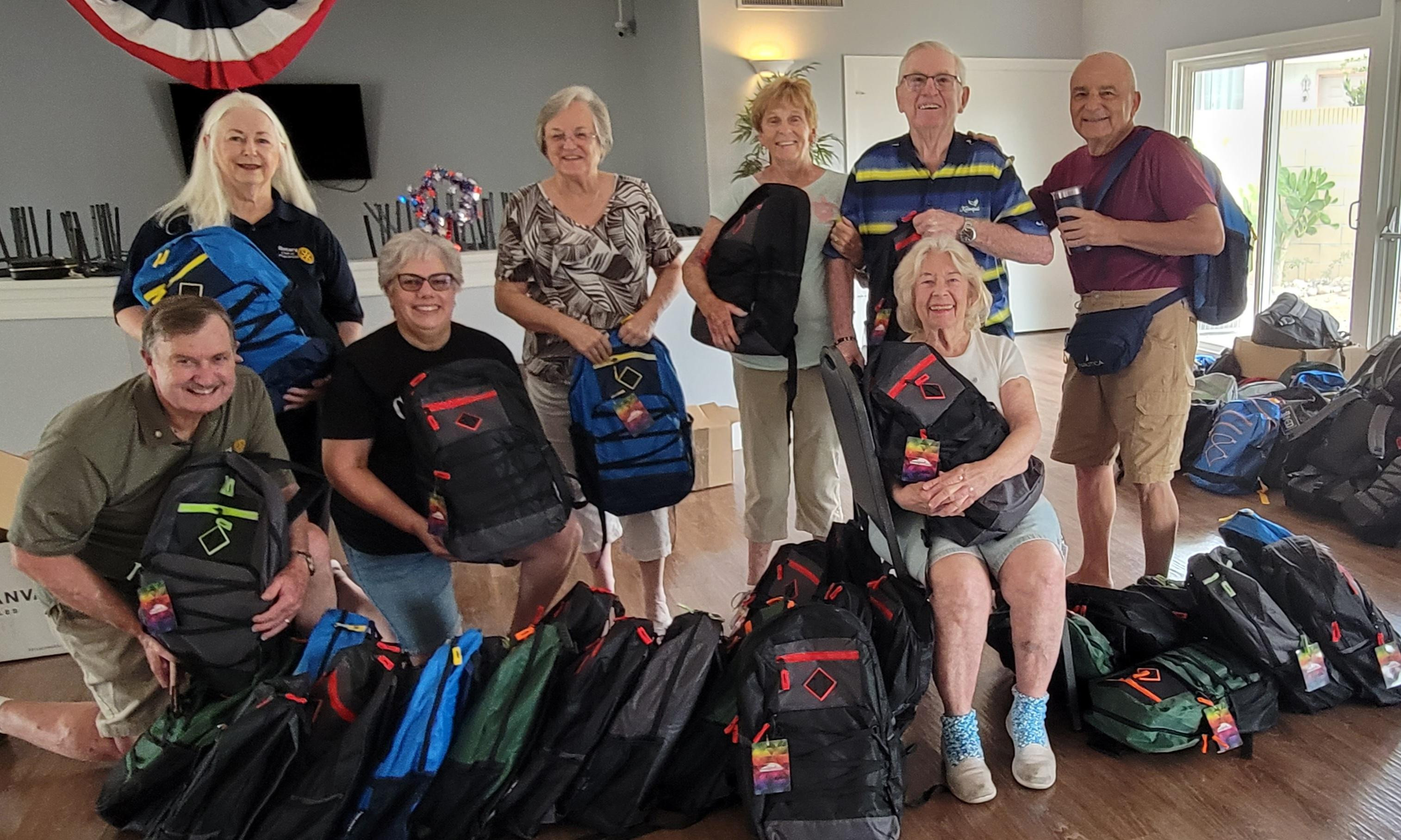 Club Has Fun Stuffing Backpacks for Lot 318