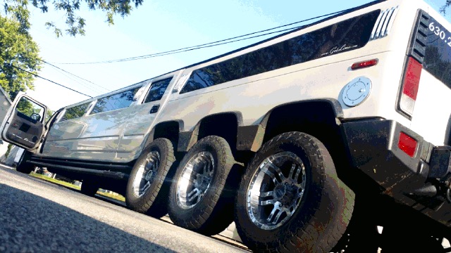 Ready For The King of All Hummer Limos? Check Out Our Triple Axle!