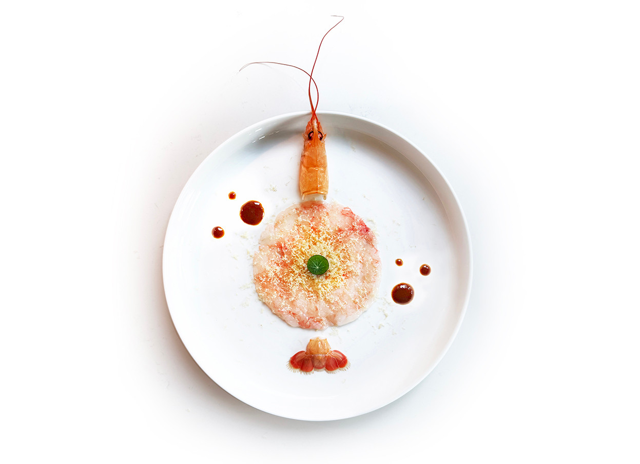 Carpaccio van langoustine met bisque reductie en foie gras