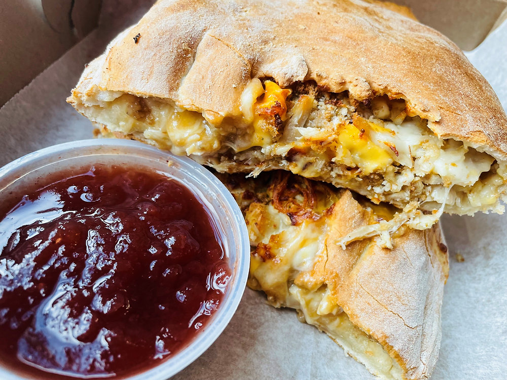 Enjoy Thanksgiving dinner, stuffed inside a savory calzone