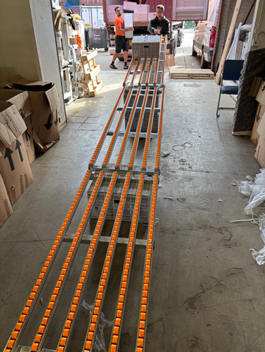 GRAVITY ROLLER FOR UNLOADING CONTAINERS | ROGUE ALLOY CO LTD