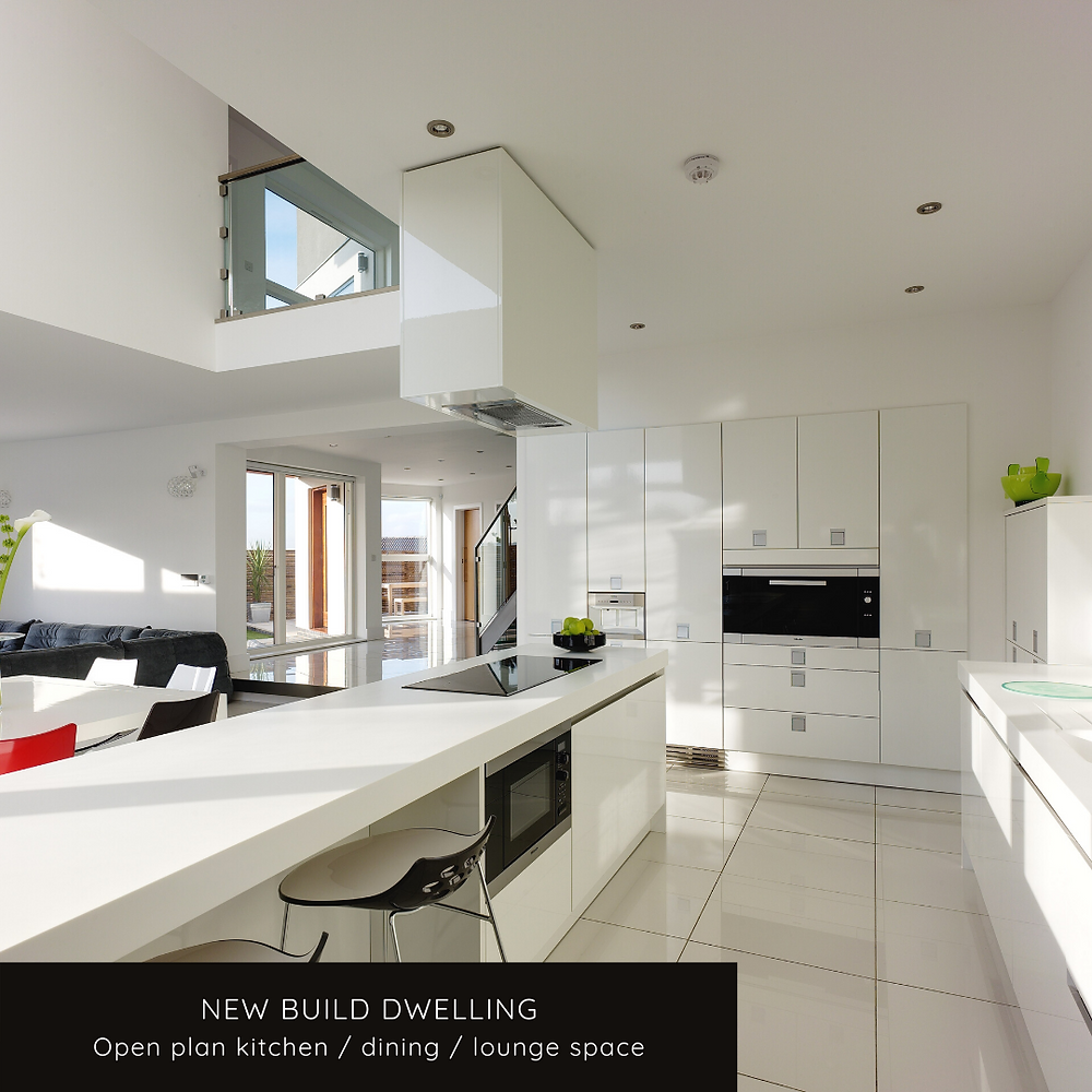 Contemporary open plan kitchen with a double height space.