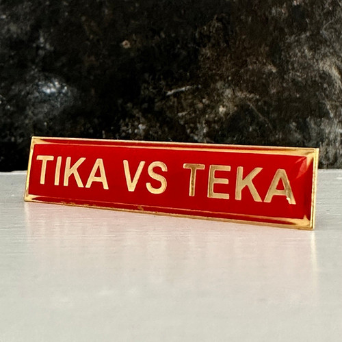 Tika VS Teka - Badge | Whare Hau Tutū