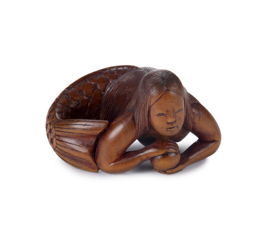 A boxwood netsuke of a mermaid by Hozan | Z&R Netsuke