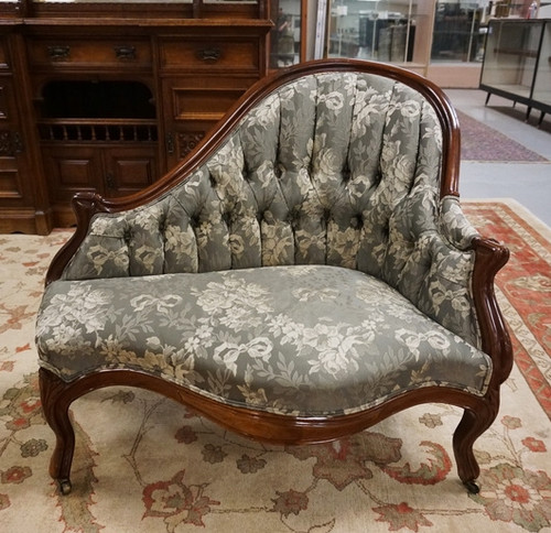 CARVED WALNUT VICTORIAN BUSTLE CHAIR WITH TUFTED BACK.38 IN WIDE, 32 IN ...