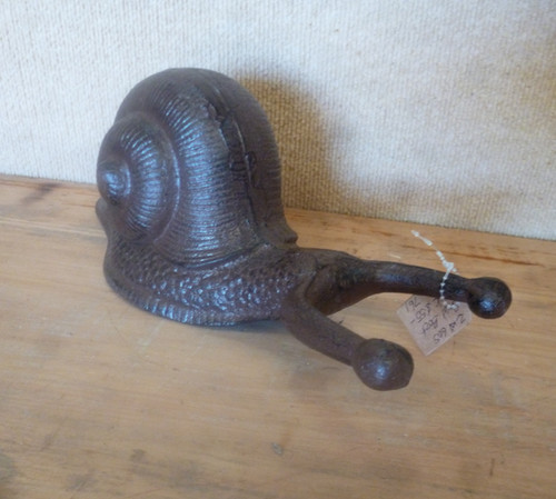 Rustic cast iron snail boot jack | Antique Effects