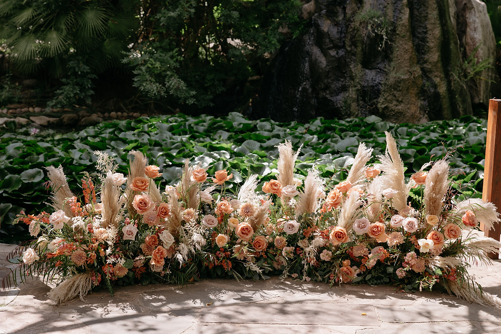 10 Stunning Grounded Floral Arch Ideas