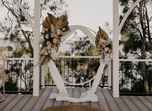 LUXE WHITE CIRCLE ARBOUR WITH FLORALS AND DRAPE | sunshinecoastpopup