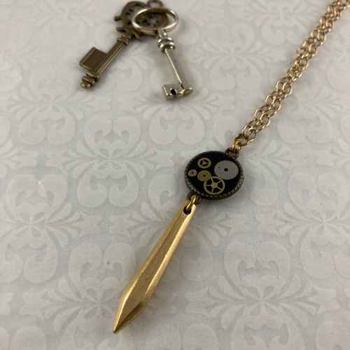 Collar con dije doble: engranes y balín | Sopa de piedra