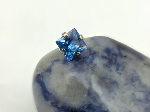 Princess cut spinel blue CZ claw set attachment | Piercings by Georgia