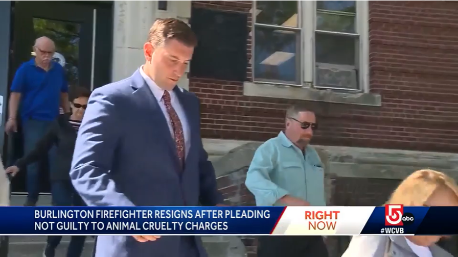 TYLER A. FALCONER, firefighter and owner of Falco K9, facing animal ...