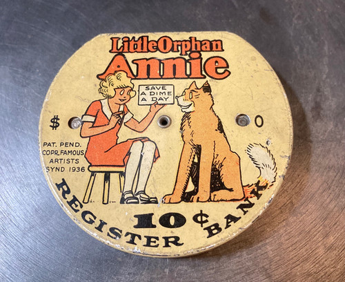 Circular tin "Little Orphan Annie" dime bank | The Ole Blacksmith S