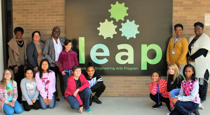 Leaphart Elementary School students share their love for math with District Office staff