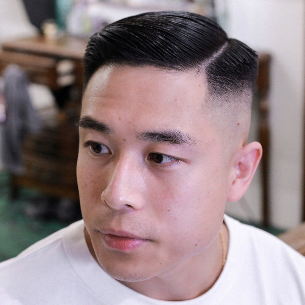 "Classic Slick Side Part with Blade Fade"