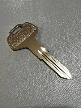 Genuine Nissan Blank Master Key | Pink Lily Pad