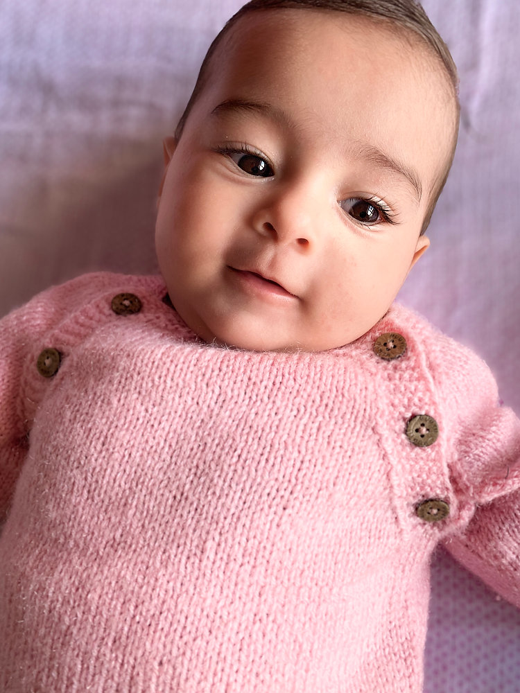 Rich history and significance of hand-knits for babies.