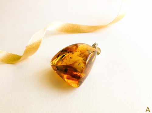 Triangle shape genuine amber pendant with insect in light cognac color ...