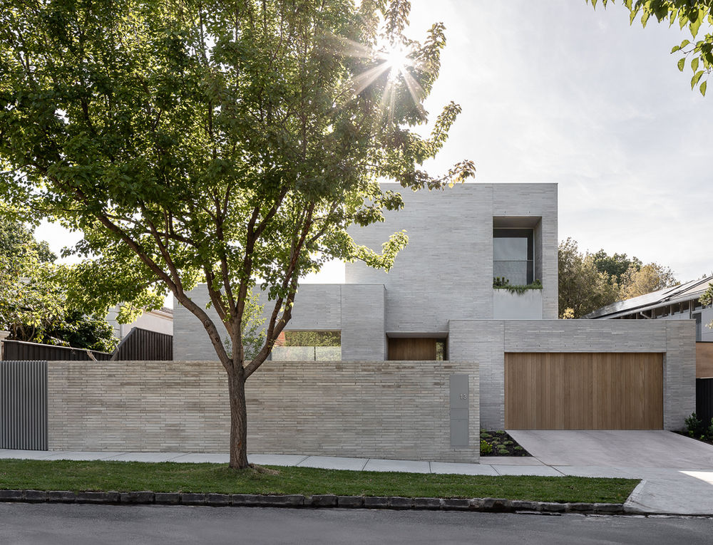 Krause Emperor bricks add a monolithic sense of calm to House Around a Pond
