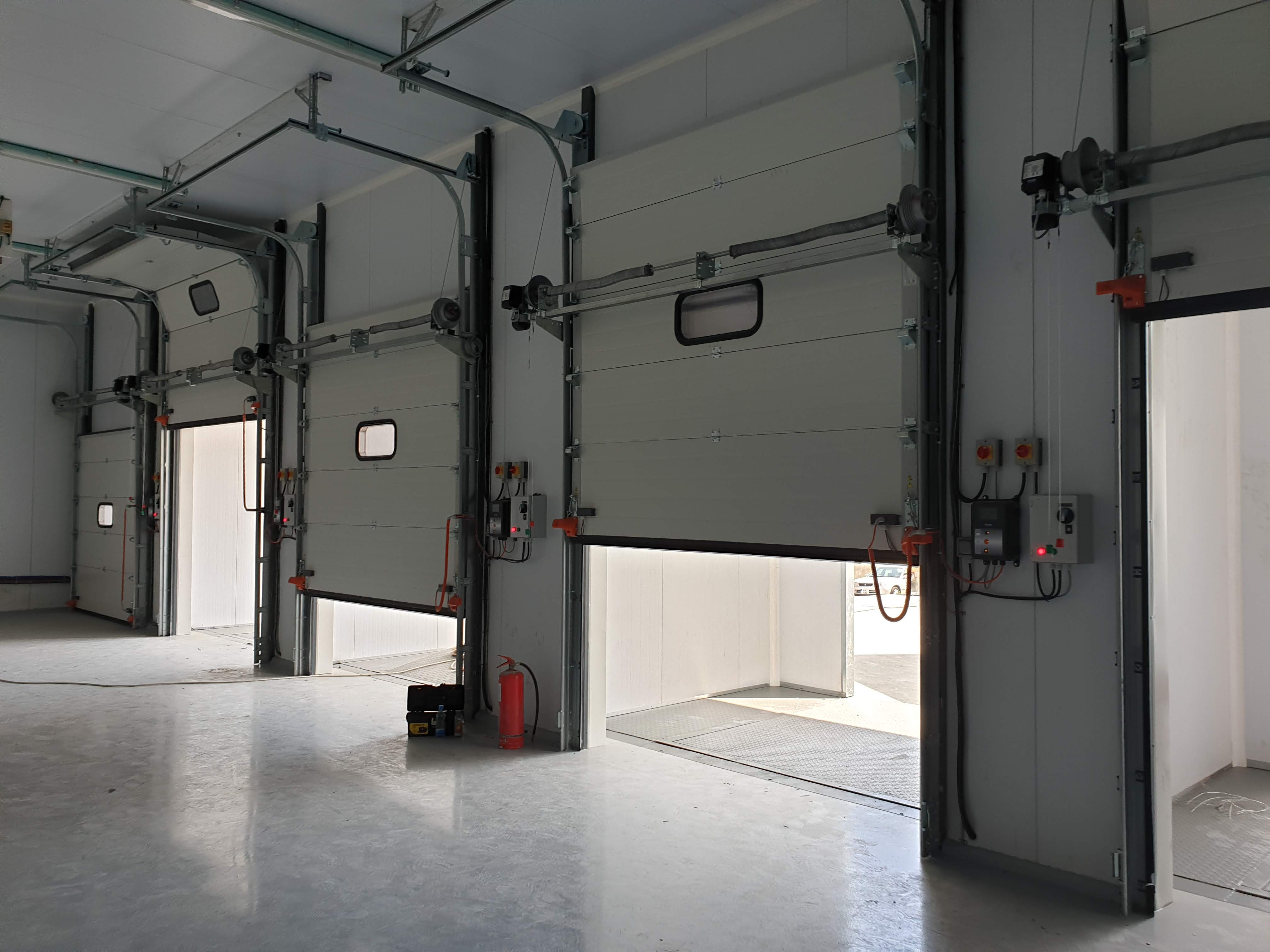 Insulated Overhead Dock Doors for Charalambides Loading Bays