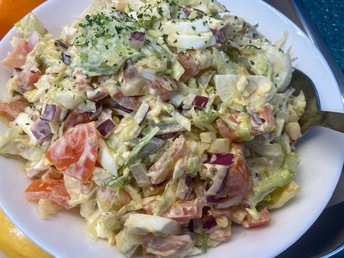 An old Traditional Salad made with Hard Boiled Egg, Tomato, Red Onion ...