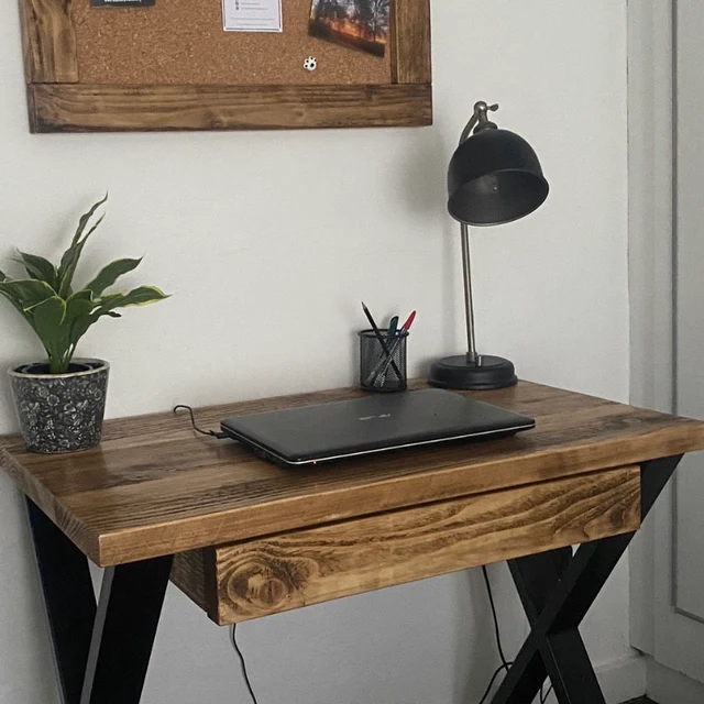 'Rustic desk with drawer storage on X legs'