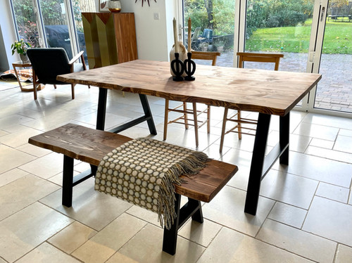 Live edge dining table and bench set on A-frame steel legs