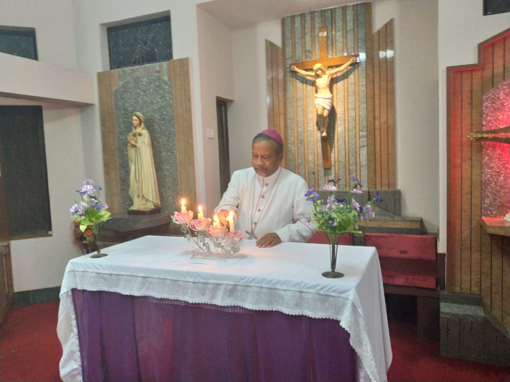 Archbishop Peter Machado joins the Nation in lighting the lamp