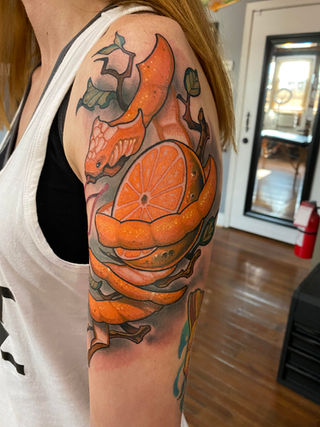 half orange slice tattoo