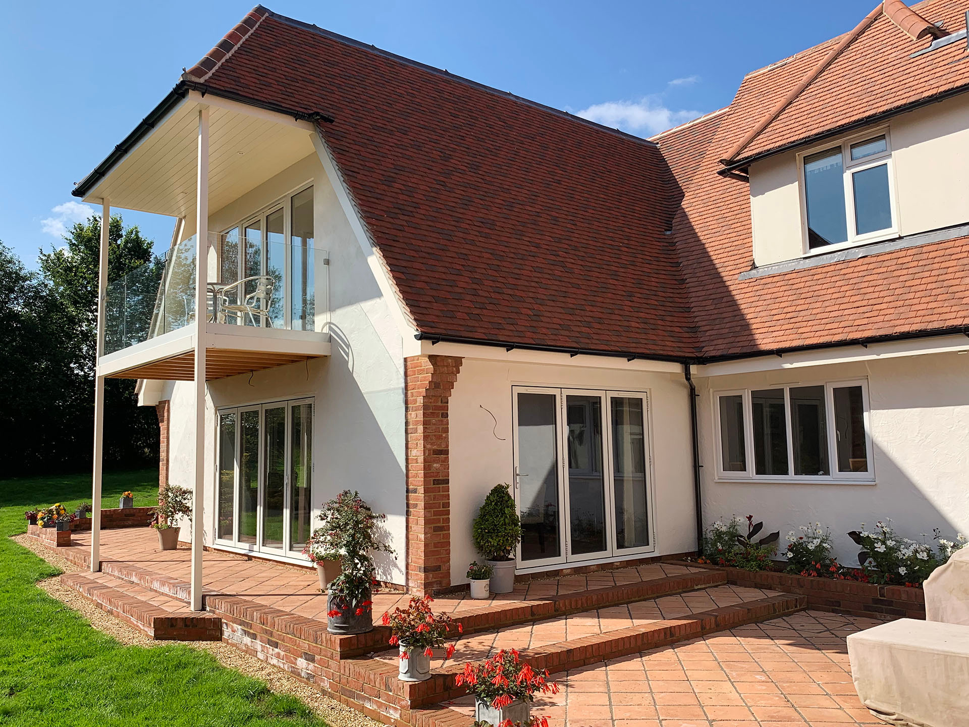 Substantial modern two storey extension with balcony