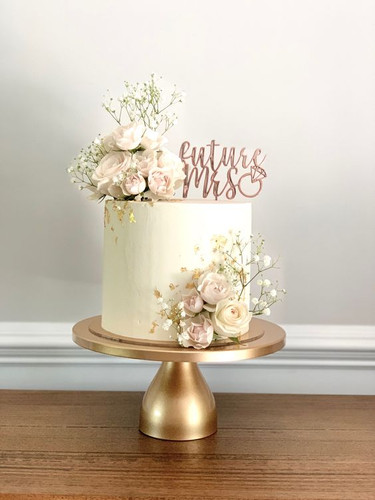 Beautiful engagement cake with white roses.