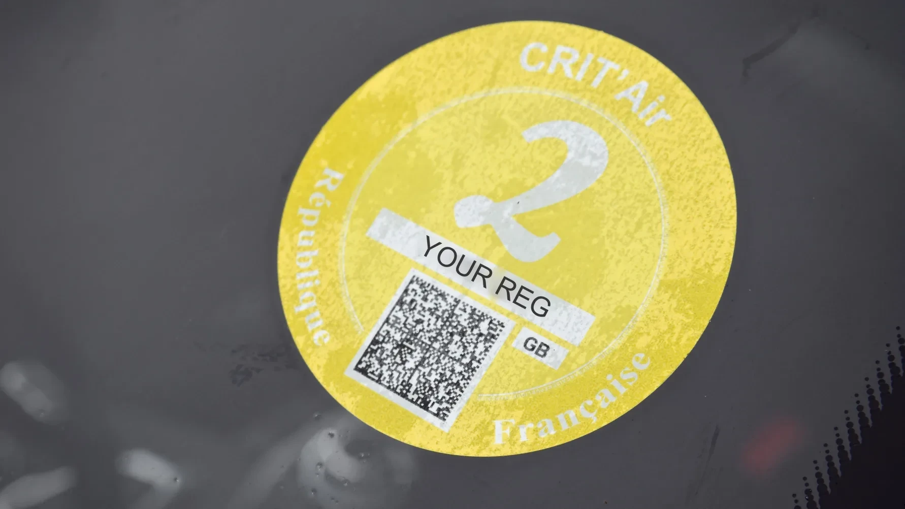 What are these new stickers seen displayed on vehicle windscreens?