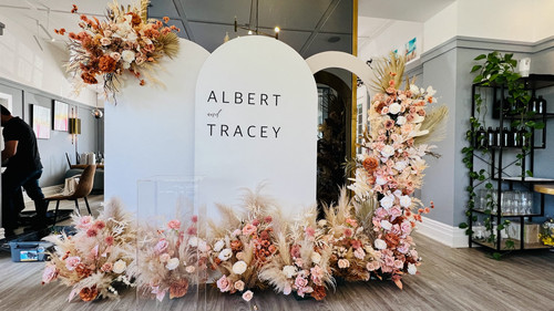 B41. white standing boards with wording and floral | The Journey Wedding