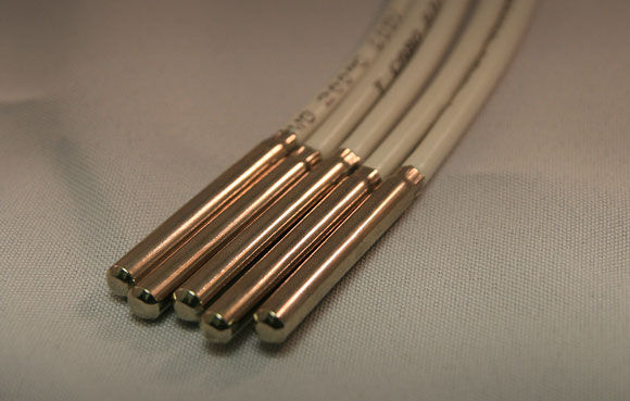 Assembly and encapsulation of temperature sensors