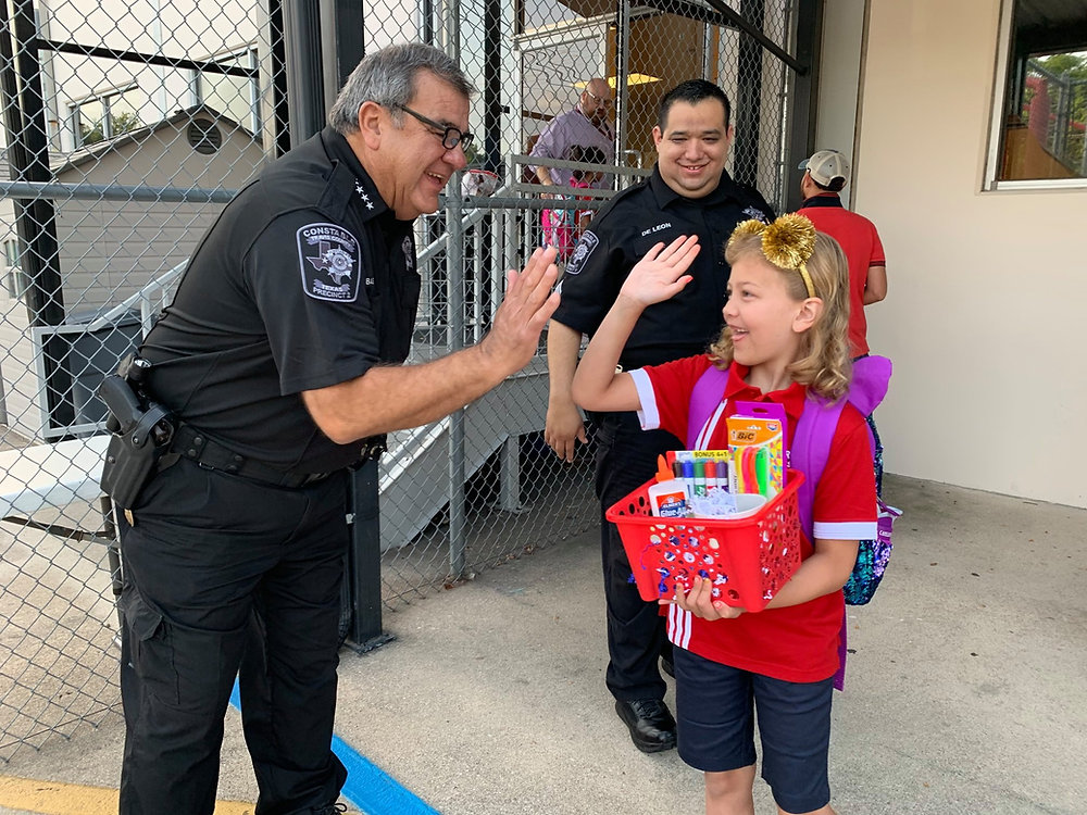 Constable Adan Ballesteros Welcomes Children Back to School