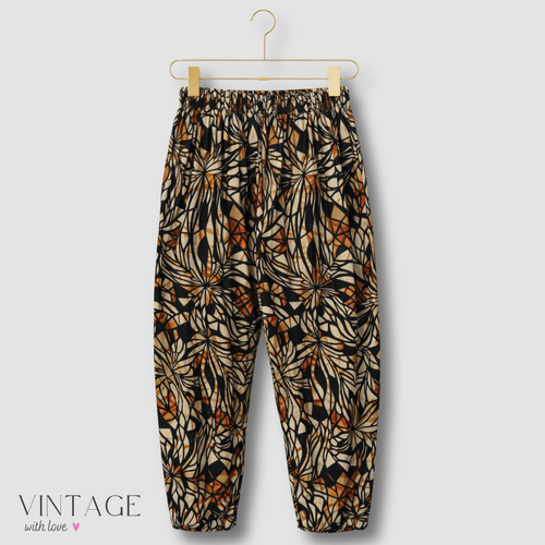 Michelle Ludek black, orange and yellow floral patterned pants - Size L ...