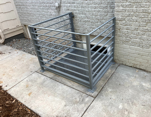 Basement window well covers with railing | Crisp Metal Fabrication